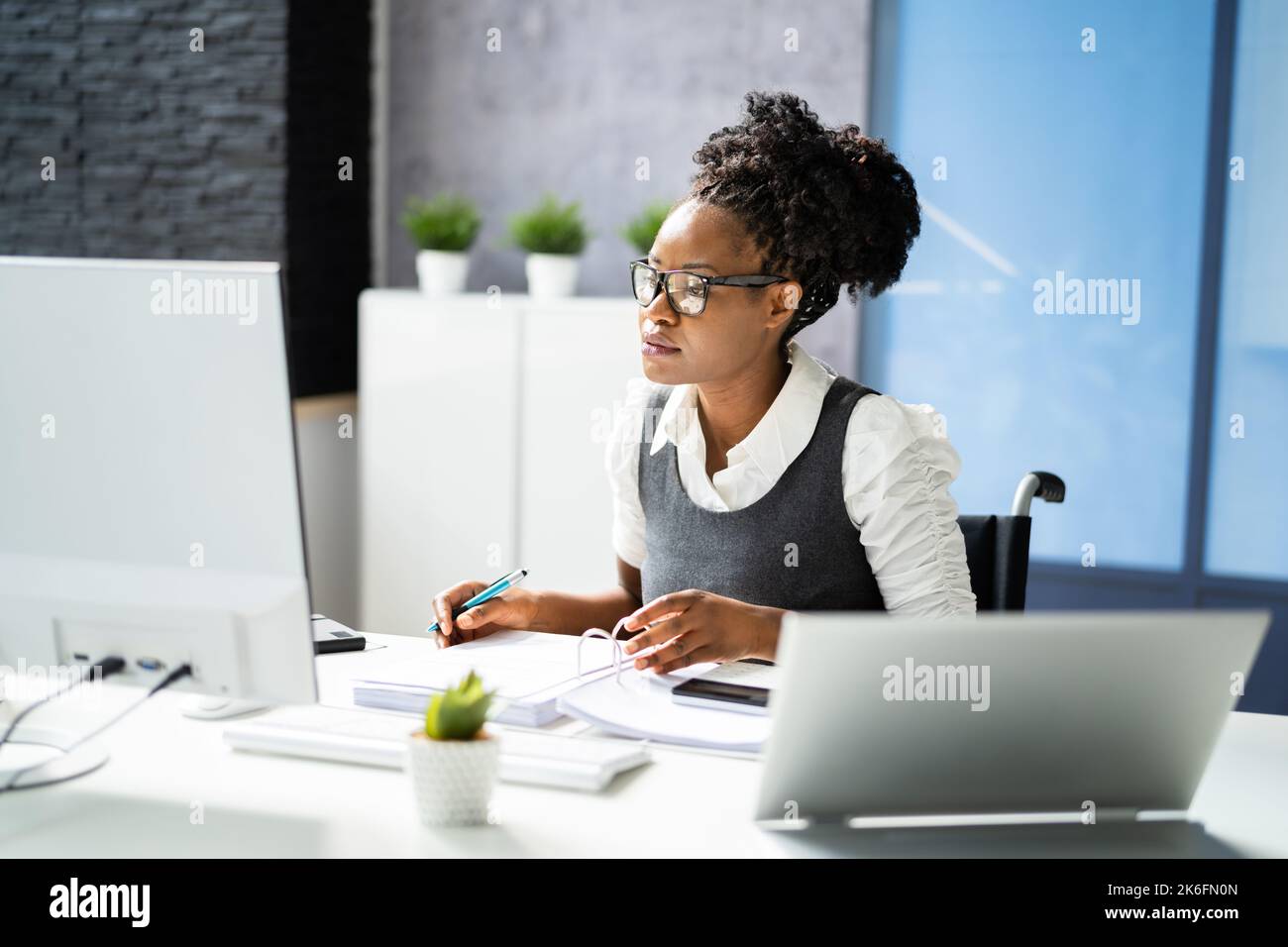 Disabled African Accountant Working On Computer In Wheelchair Stock ...