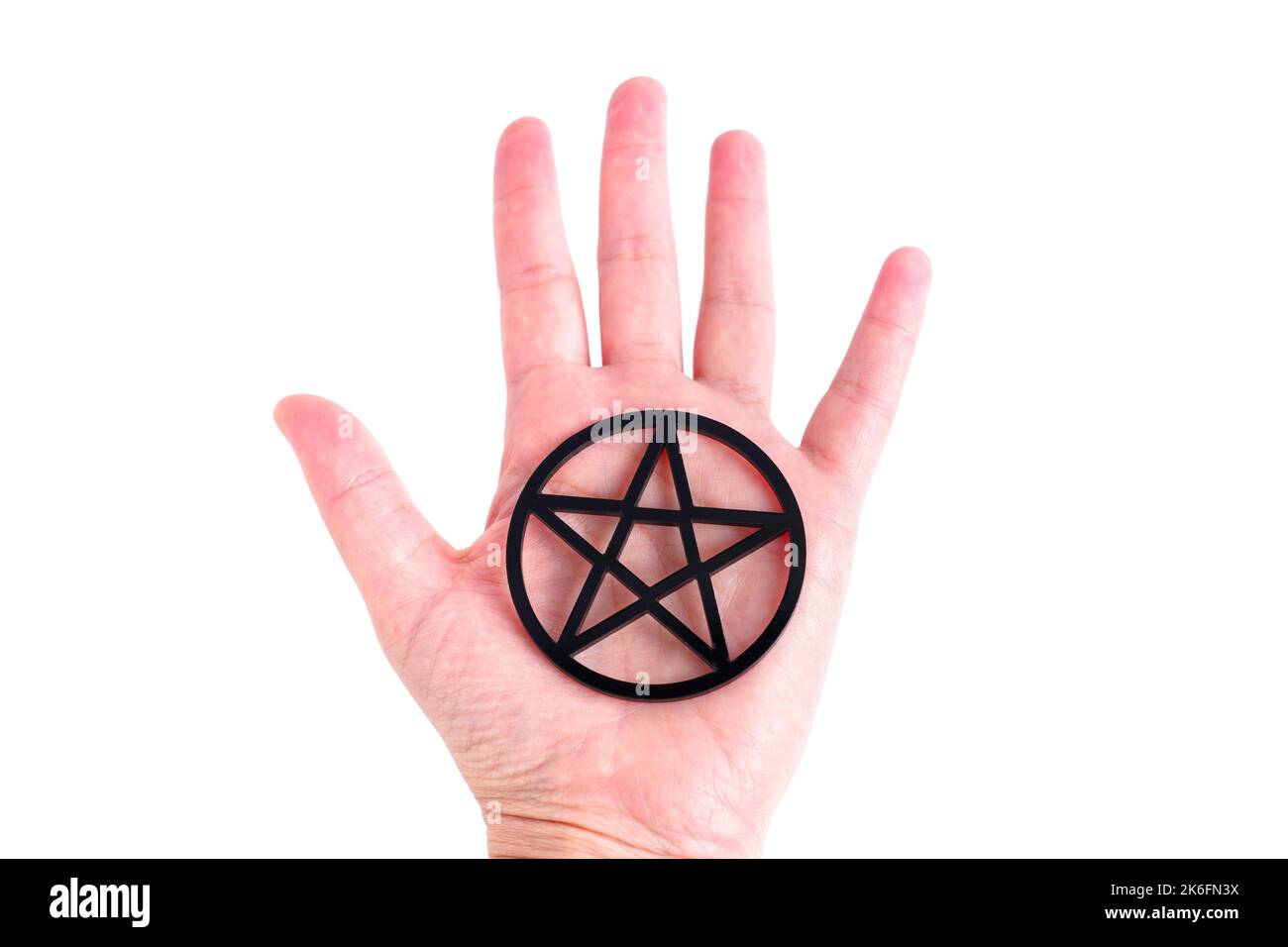 Large black five-point star with a circle around in hand isolated on ...