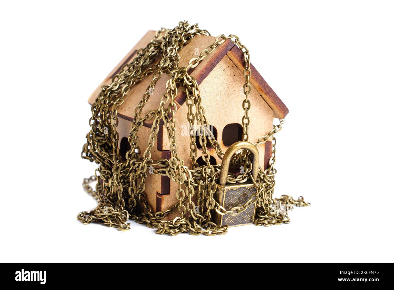 Home protection concept: small wooden house model covered in chains and ...