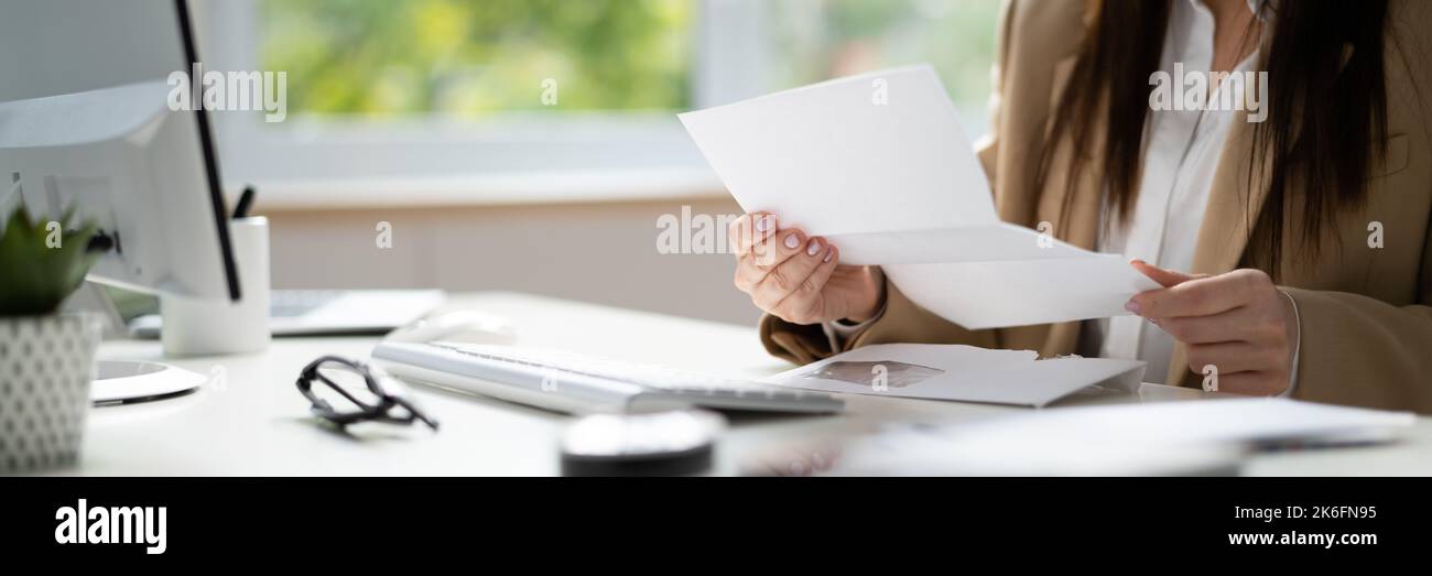 Woman Reading Paper Document. Invoice Mail Letter Stock Photo - Alamy