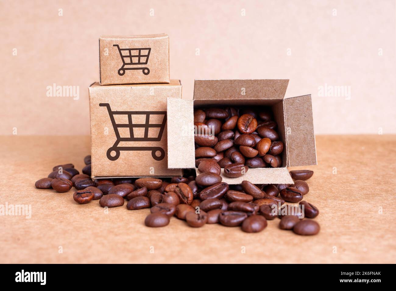 Tiny cardboard boxes with shopping cart icons printed on the front side ...