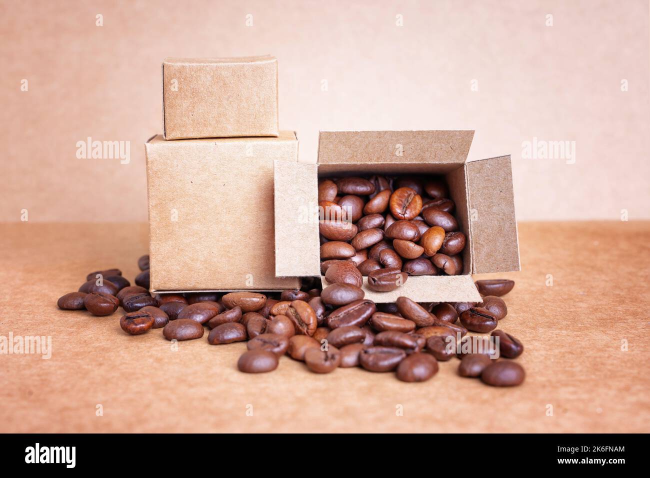 Miniature shipping boxes full of roasted coffee beans isolated on a ...