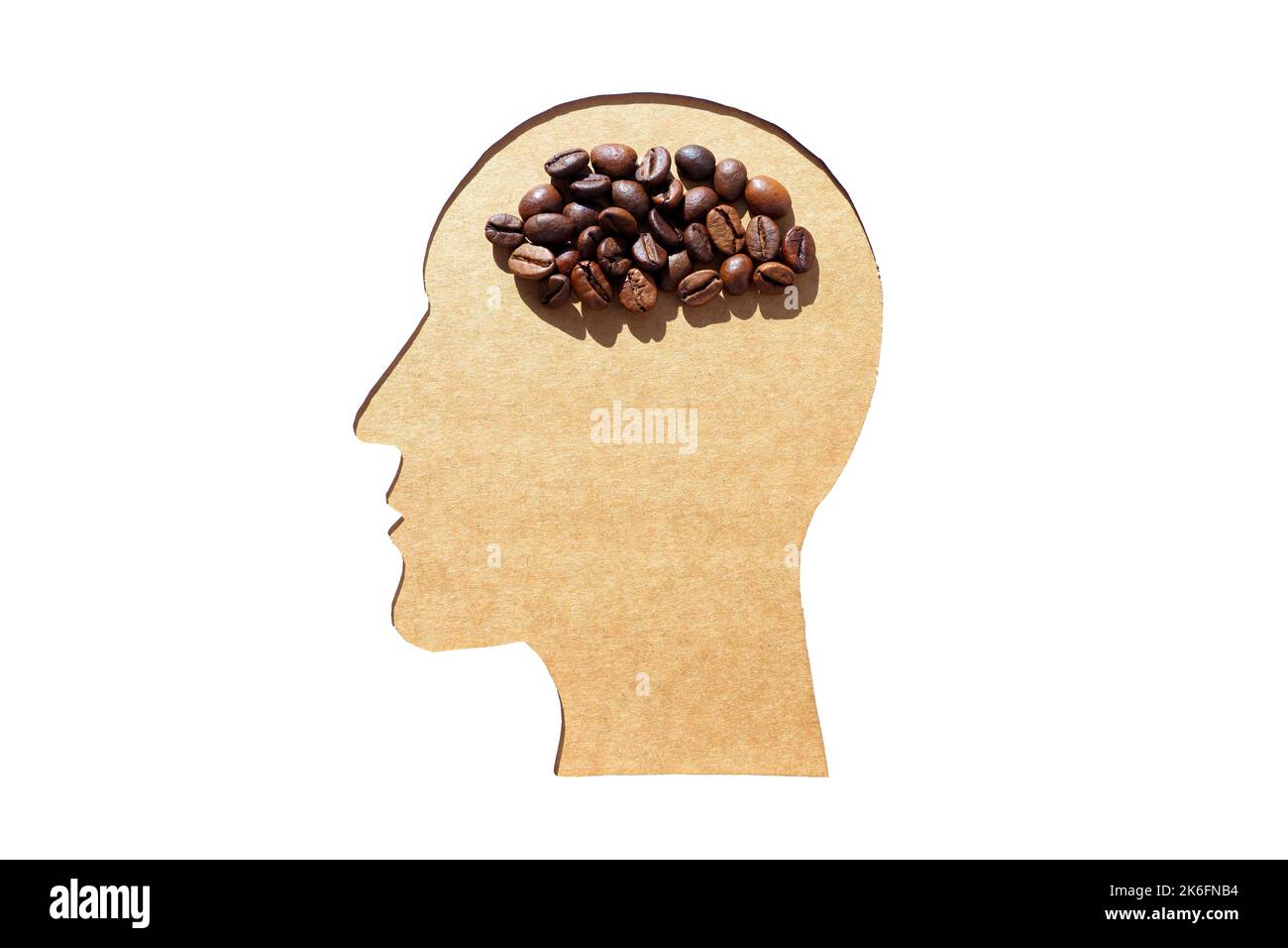 Male head profile shape paper cut-out with roasted beans imitating the ...