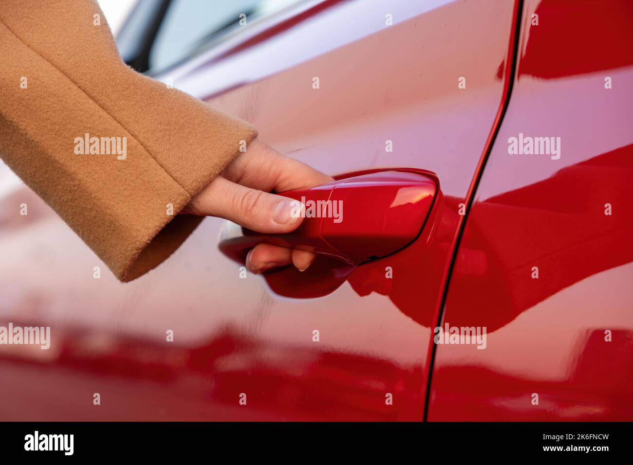Person opens red car door hi-res stock photography and images - Alamy