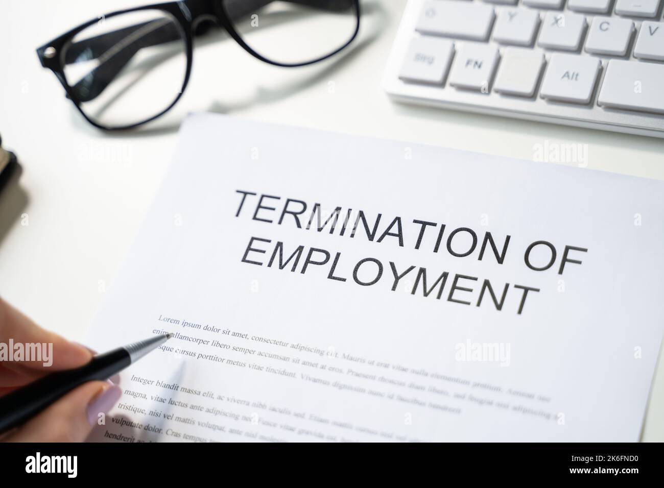 Documents About Termination Of Employment With Pen Stock Photo - Alamy