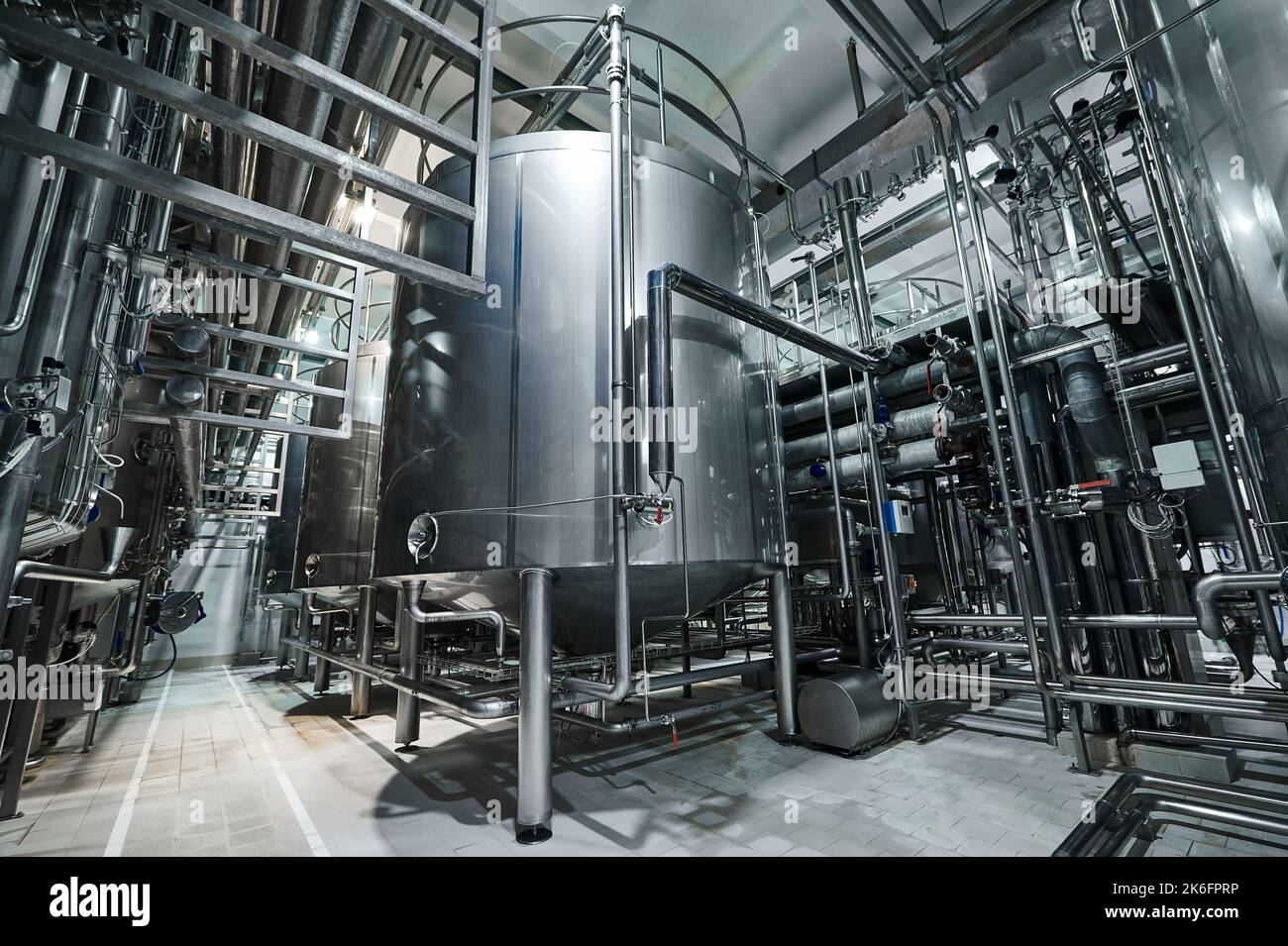 Stainless steel tanks, many pipes and valves, food production Stock ...
