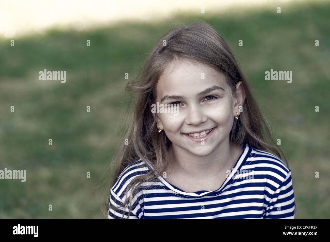 Smile that makes lasting impression. Happy child smile summer outdoors ...