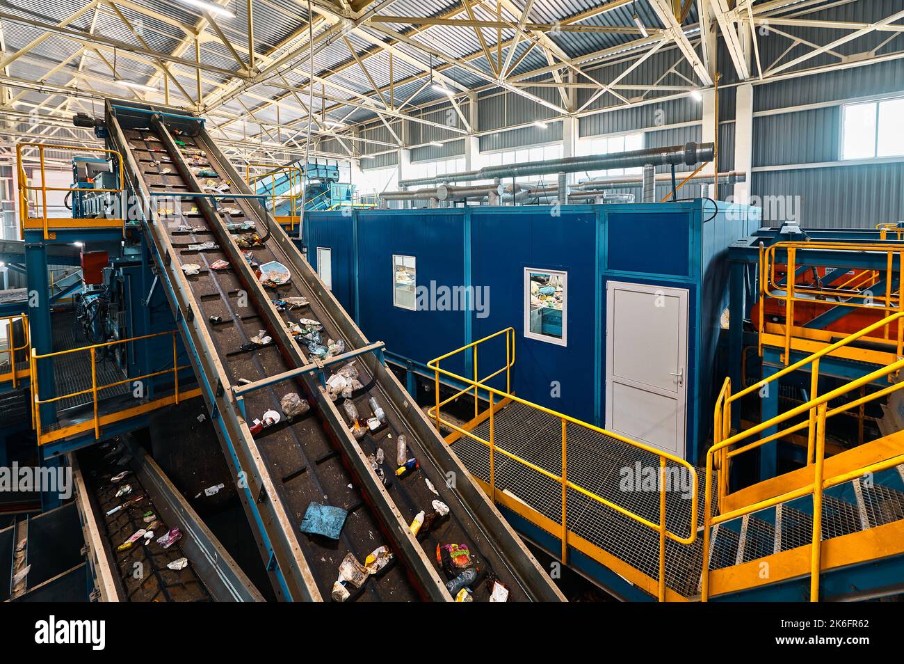 System of conveyors carrying trash at waste processing plant Stock Photo - Alamy