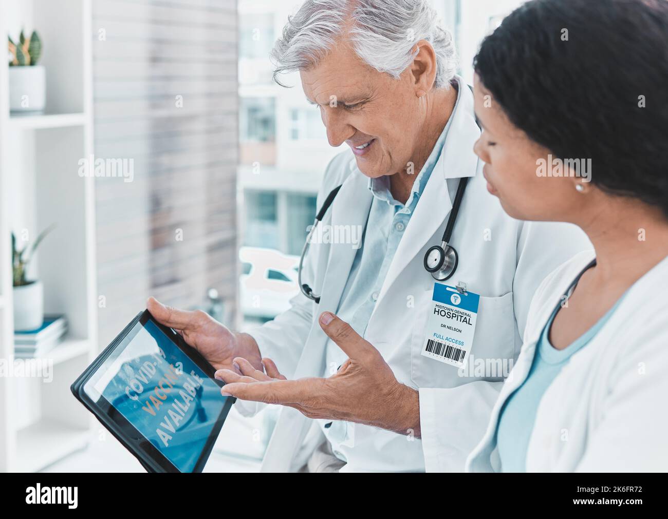 The new system is so simple. a senior doctor signing a patient up for ...