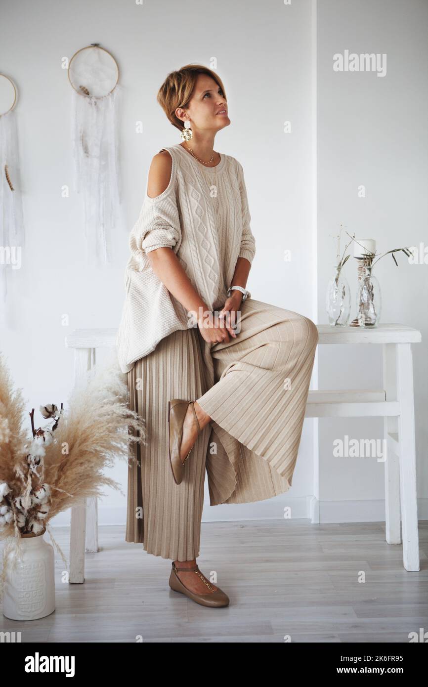 Beautiful woman, interior designer thinking how to decorate a new house ...