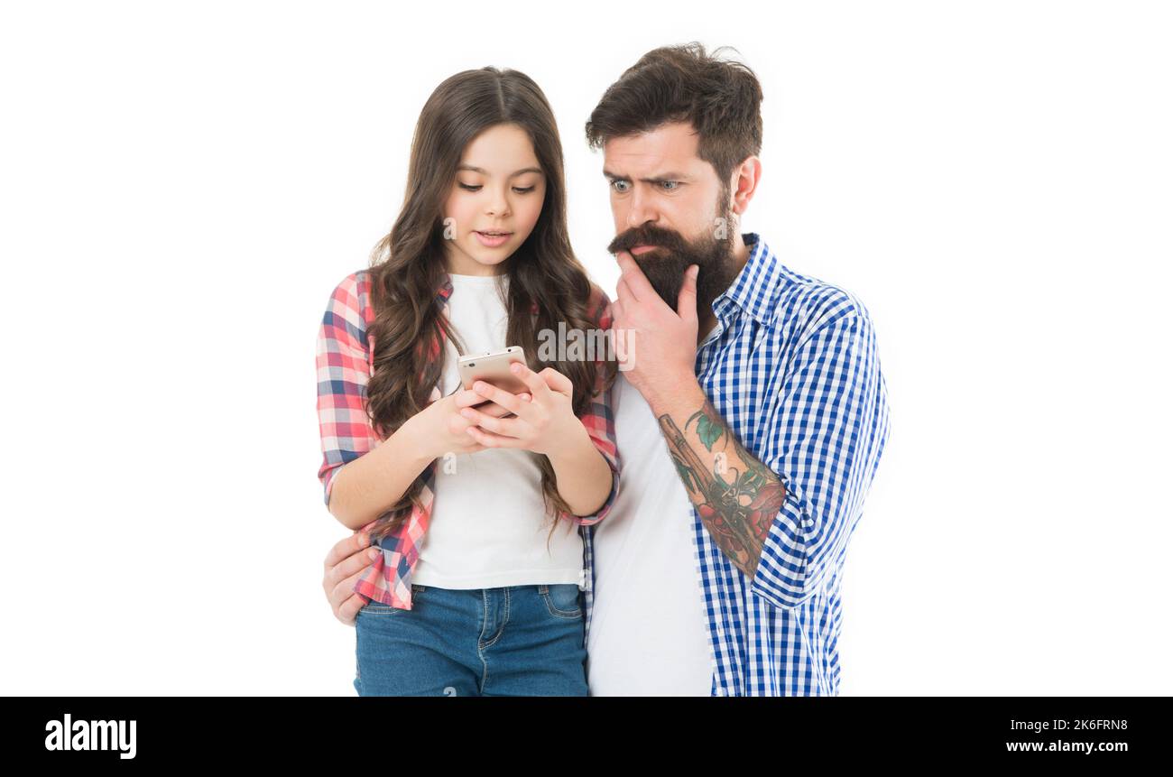 Father and daughter set up smartphone. Modern technology. Little girl ...