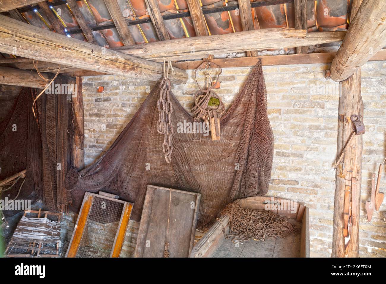 The inside of an old barn in the Netherlands, filled with old stuff ...