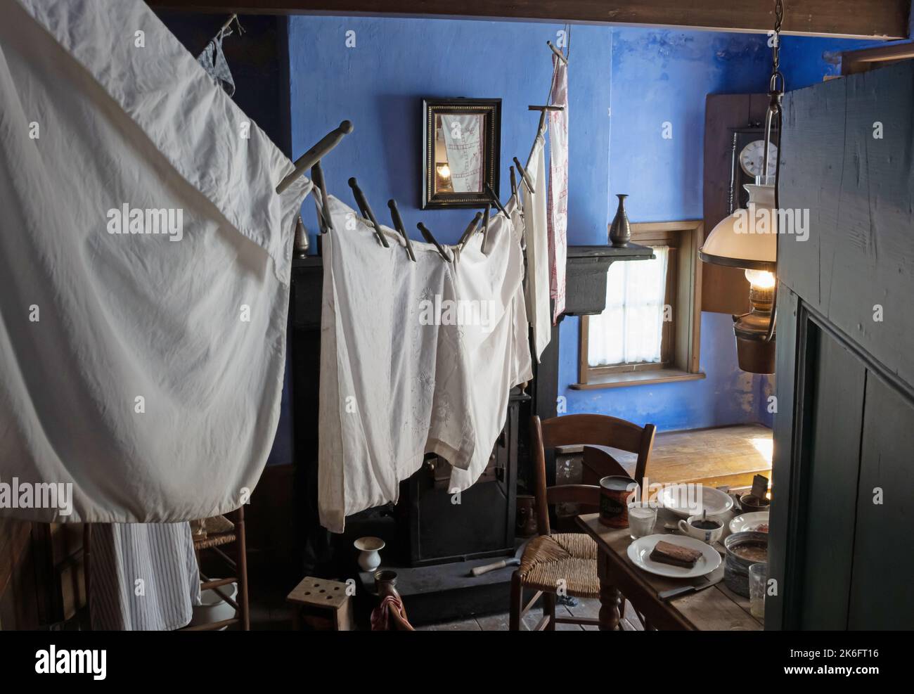The interior of a Dutch living room from the 1900s, laundry hanging to ...