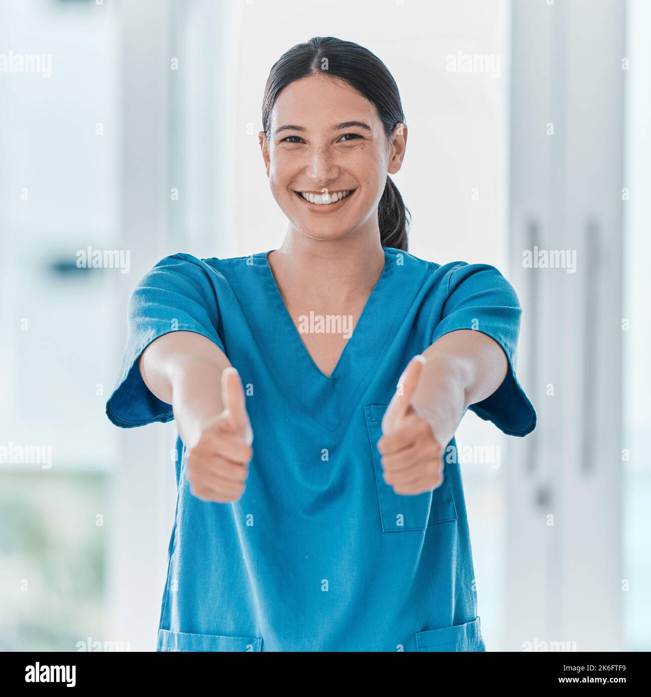 You have nothing to worry about. Portrait of a young doctor showing ...