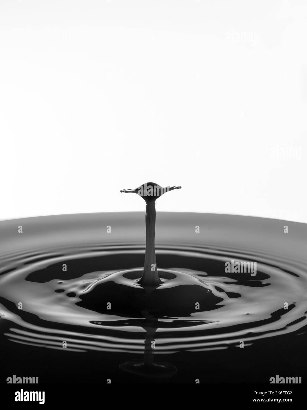 Water drop collision on a white background Stock Photo - Alamy