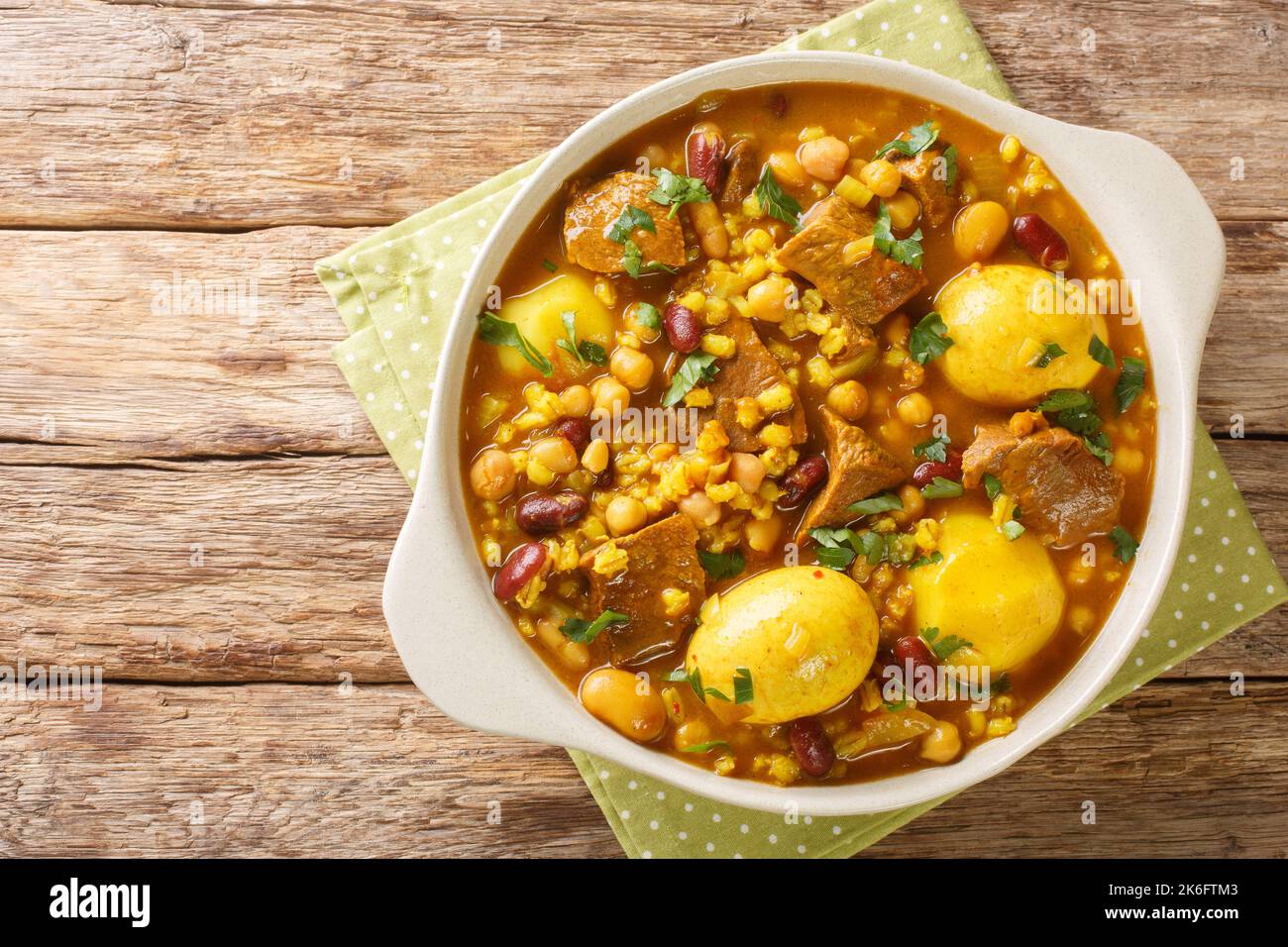 Traditional Jewish stew Cholent Hamin on Sabbath Day closeup in the pan ...