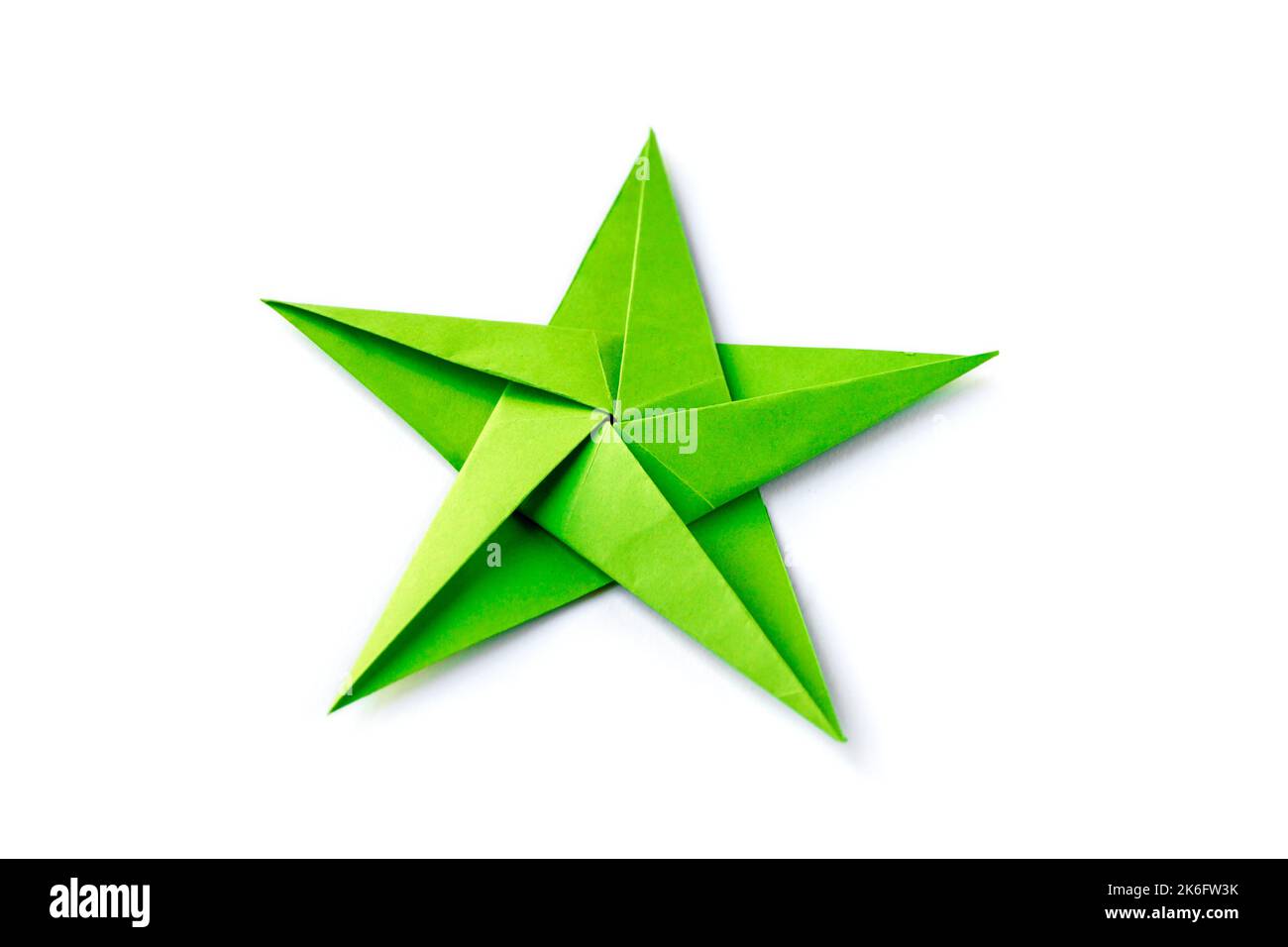 Green paper star origami isolated on a blank white background Stock ...