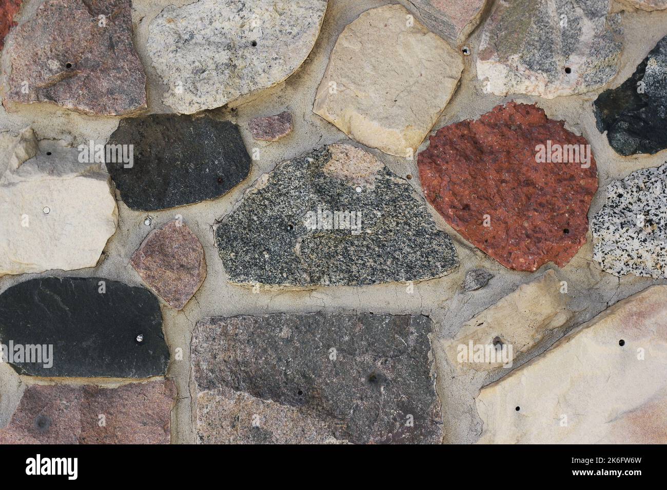 Natural stone wall made with a random pattern Stock Photo - Alamy