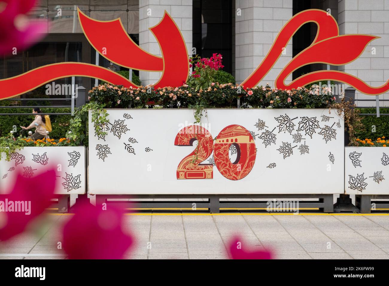 SHANGHAI, CHINA - OCTOBER 14, 2022 - Bright flowers and red streamers ...