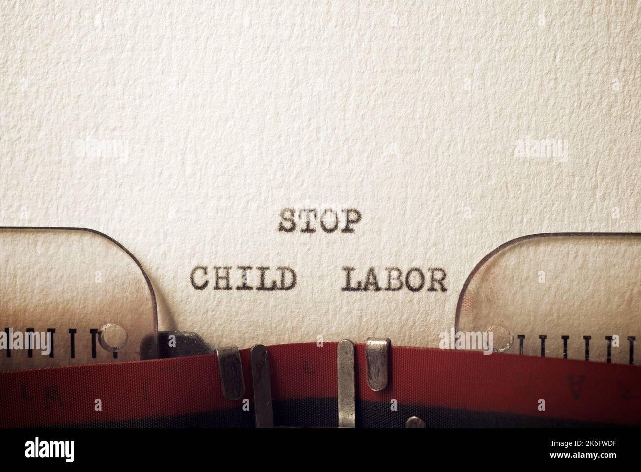 Stop child labor text written with a typewriter Stock Photo - Alamy