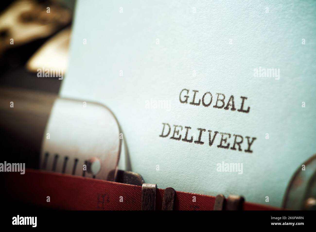 Global delivery text written with a typewriter Stock Photo - Alamy