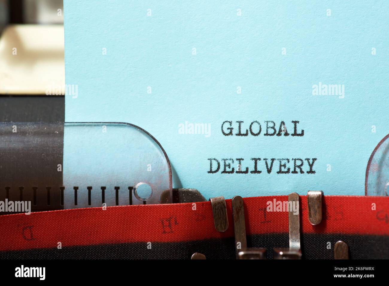 Global delivery text written with a typewriter Stock Photo - Alamy