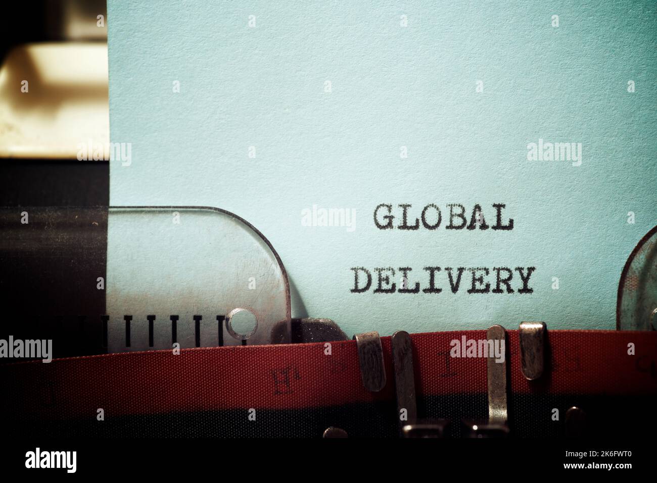 Global delivery text written with a typewriter Stock Photo - Alamy
