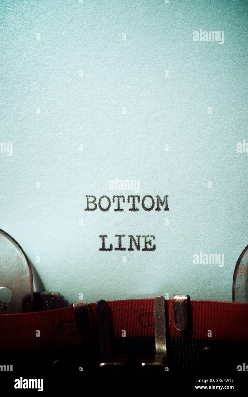 Bottom line text written with a typewriter Stock Photo - Alamy