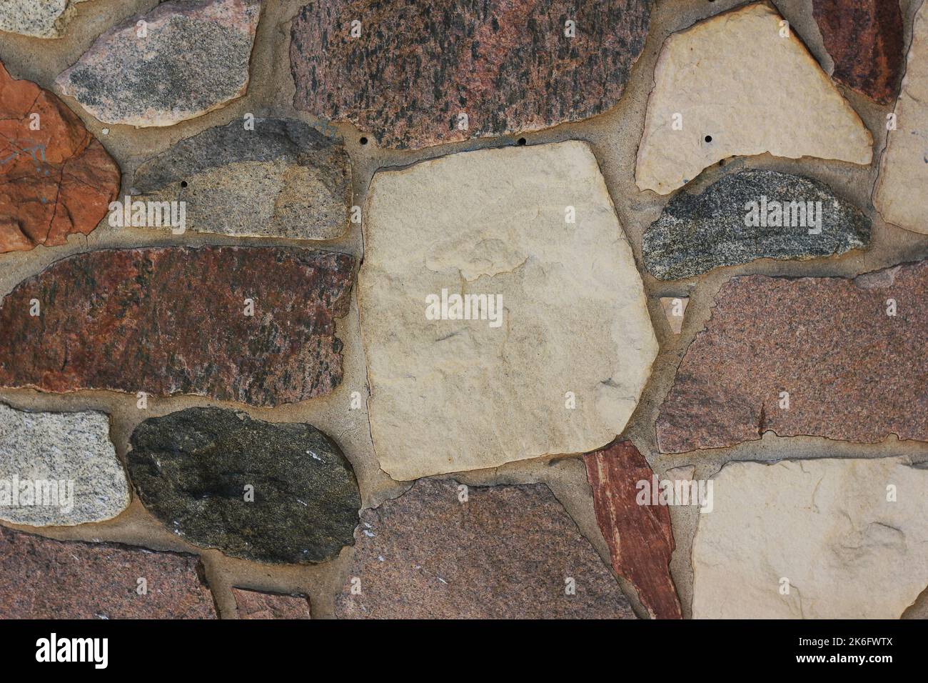 Natural stone wall made with a random pattern Stock Photo - Alamy