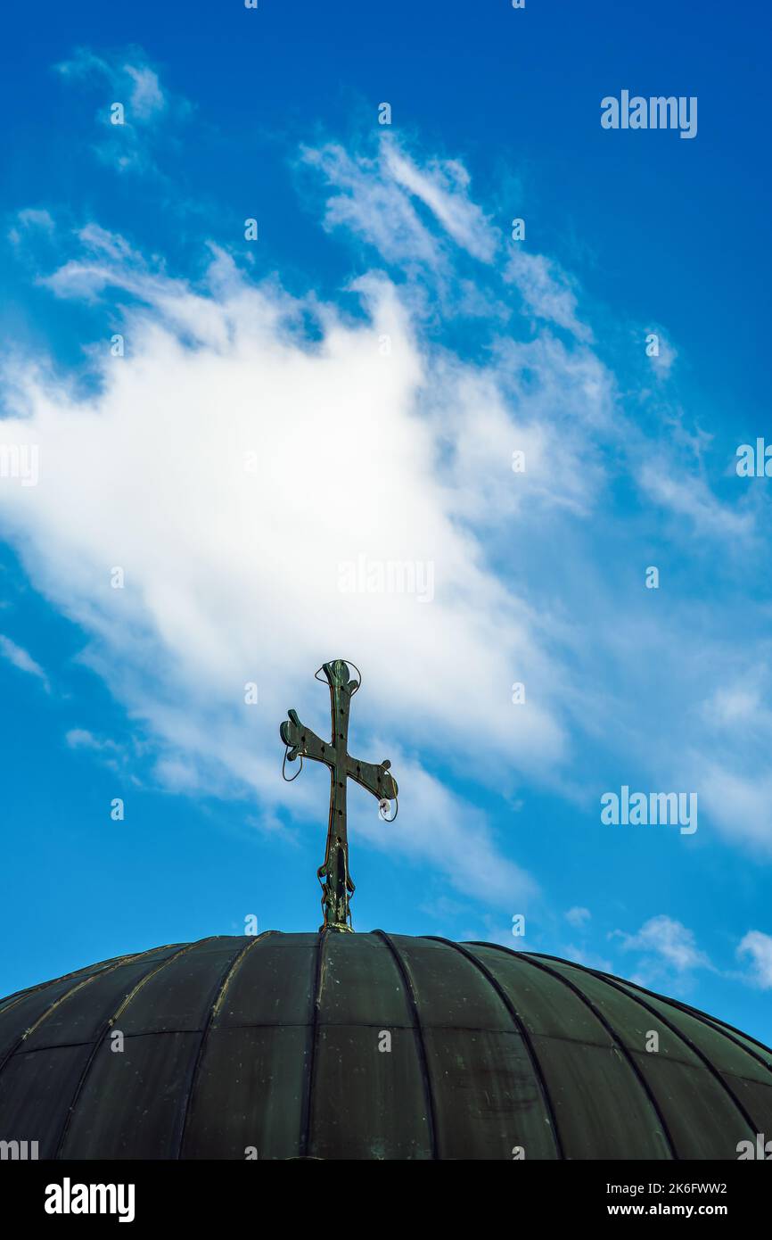 Low-rise day sunny view of Christian Orthodox Church rooftop cross ...