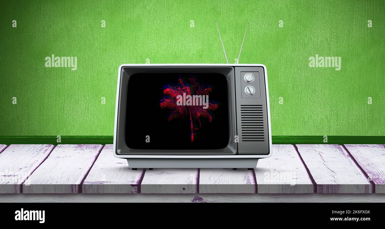 Composite of palm tree in television set over wooden table against ...