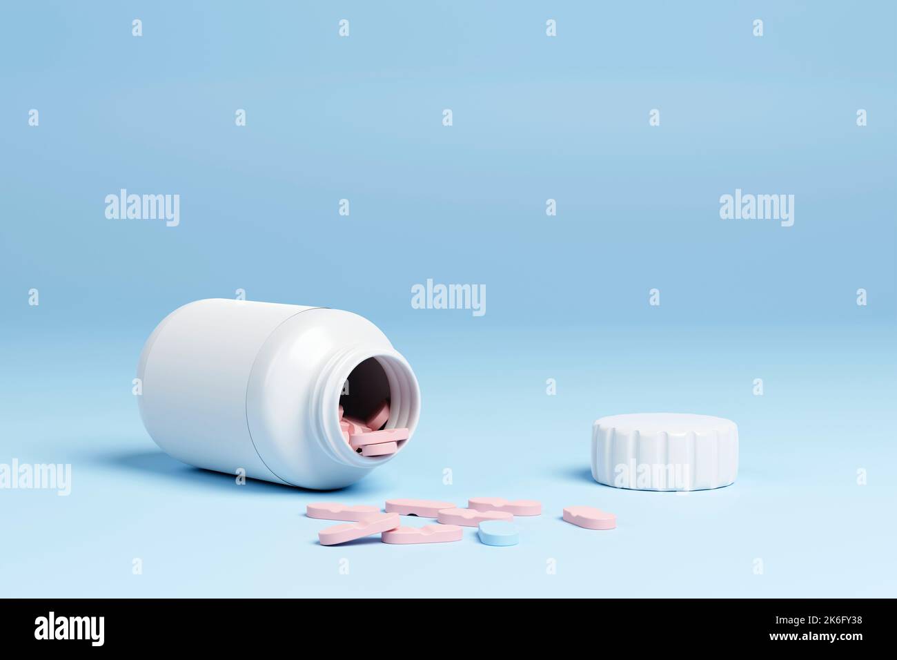 Plastic medical container and pink capsule pills on gray blue ...