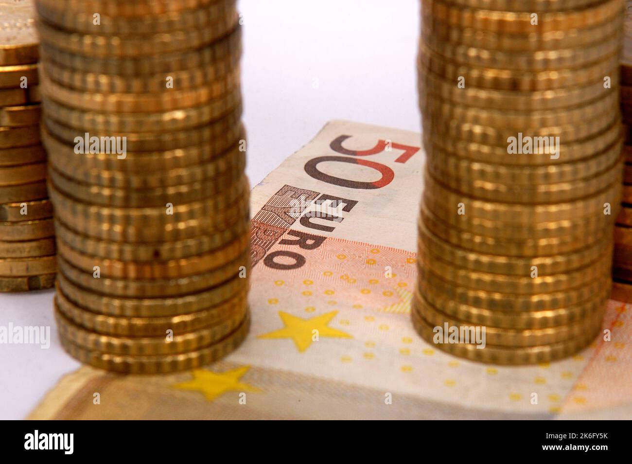 Pile of euro coins on a bill Stock Photo - Alamy