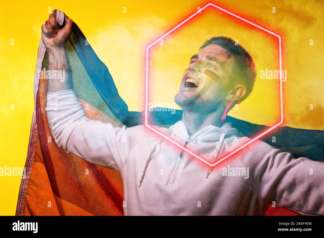 Male caucasian player with german flag screaming over illuminated ...