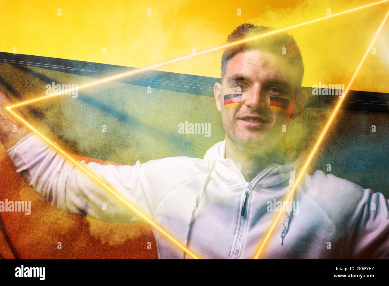 Portrait of male caucasian player holding german flag and screaming ...