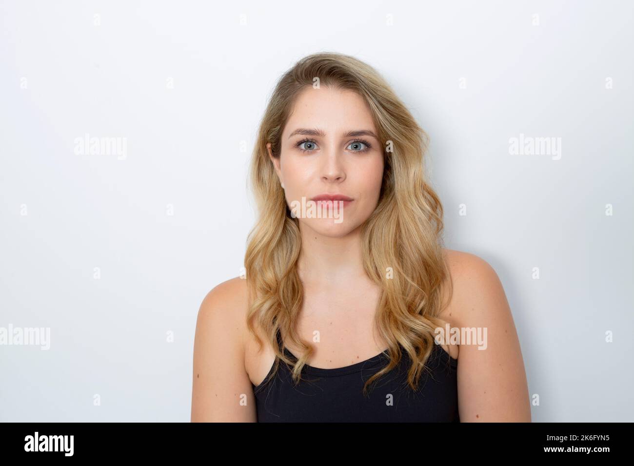 photo of young blonde woman on white background Stock Photo - Alamy