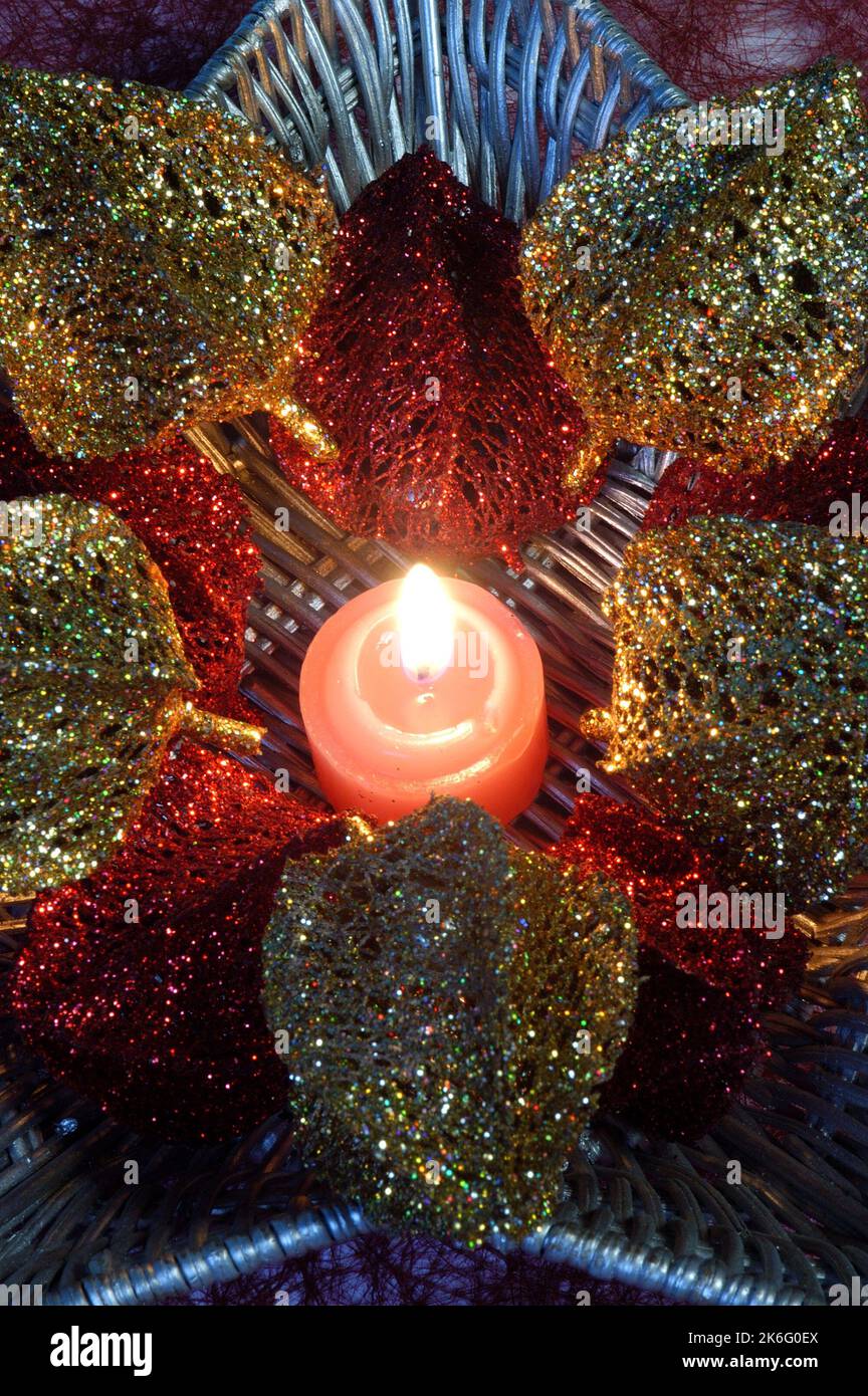 Lit candle with christmas decoration Stock Photo - Alamy