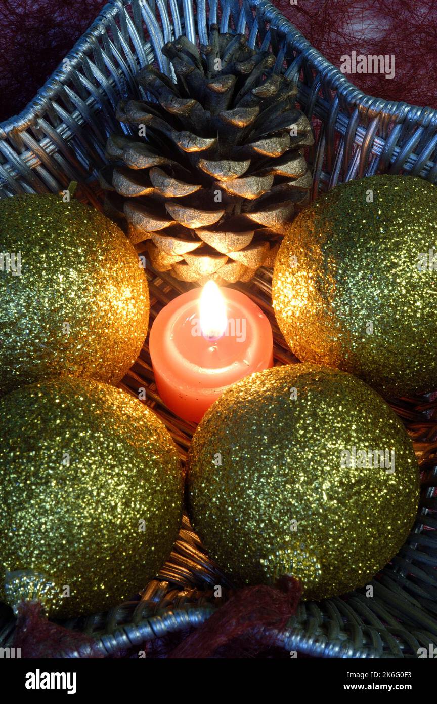 Lit candle with christmas decoration Stock Photo - Alamy