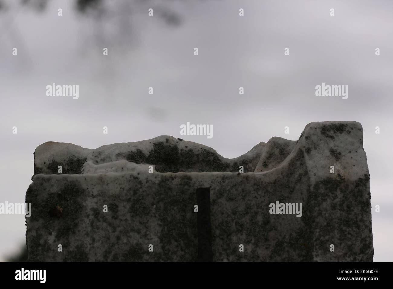 Stone statue of a human figure in repose Stock Photo - Alamy