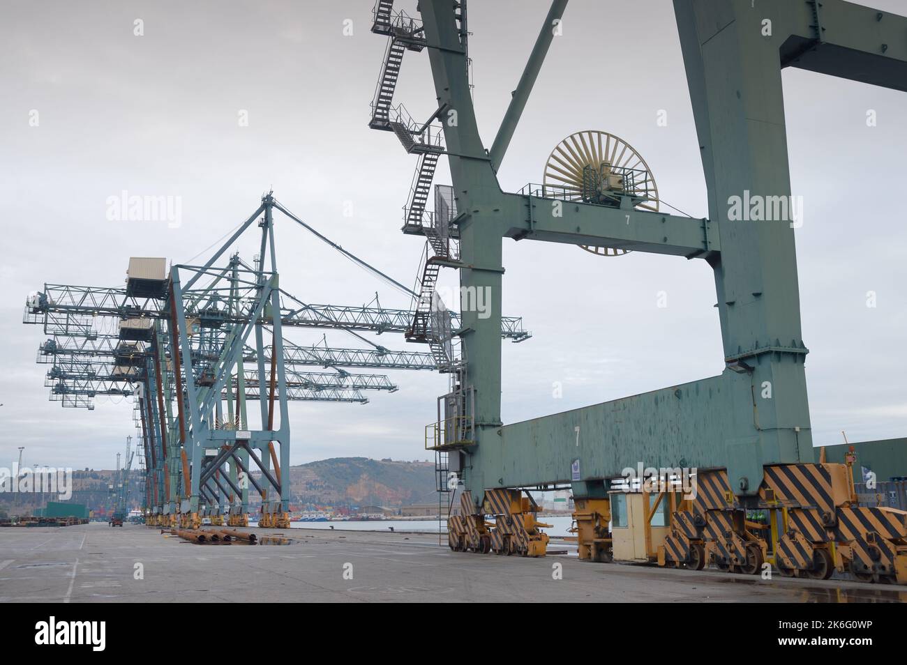 Large cranes in the loading area of a port Stock Photo - Alamy