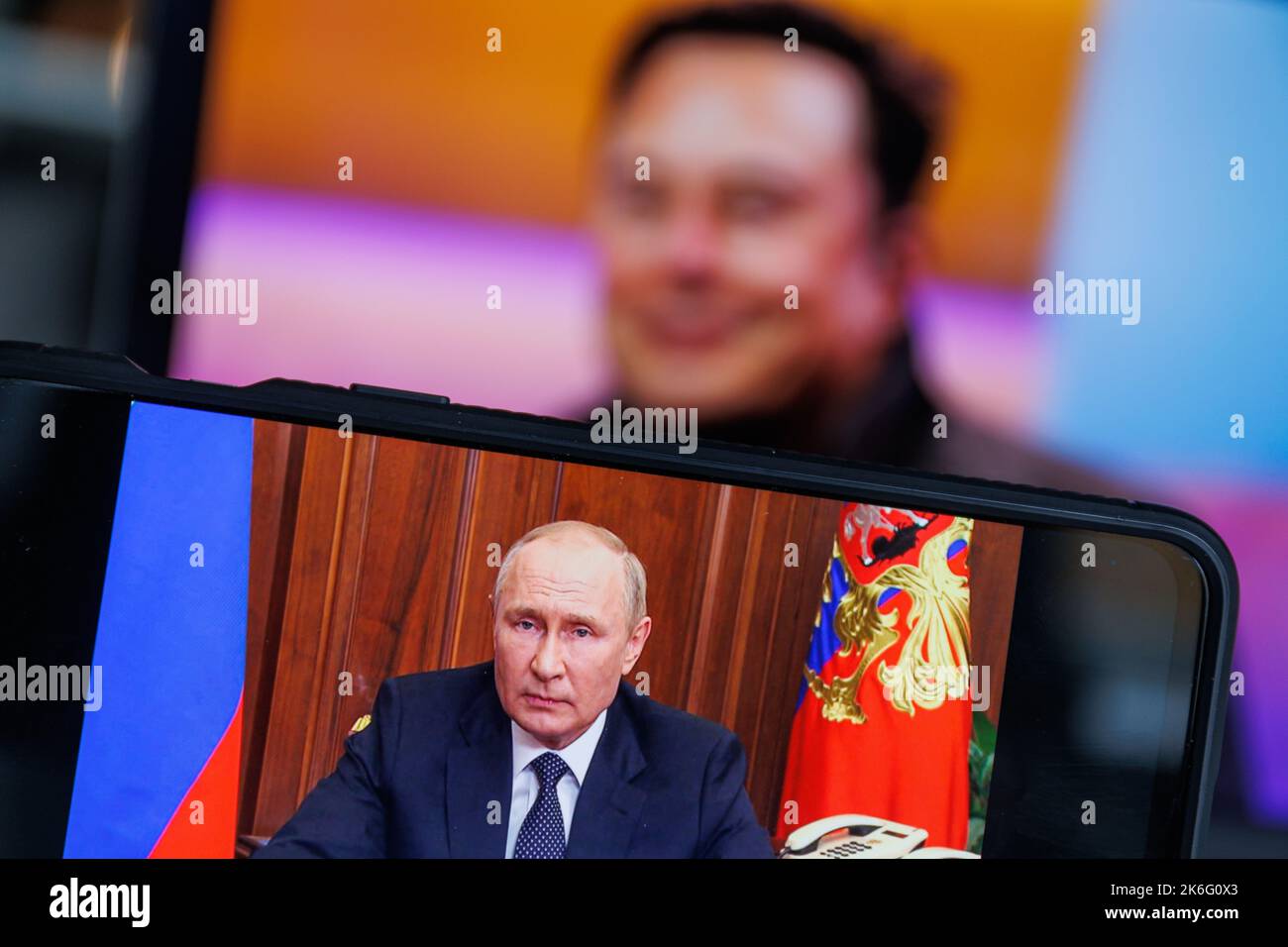 Vilnius, Lithuania - 2022 October 13: Elon Musk on screen and Vladimir ...