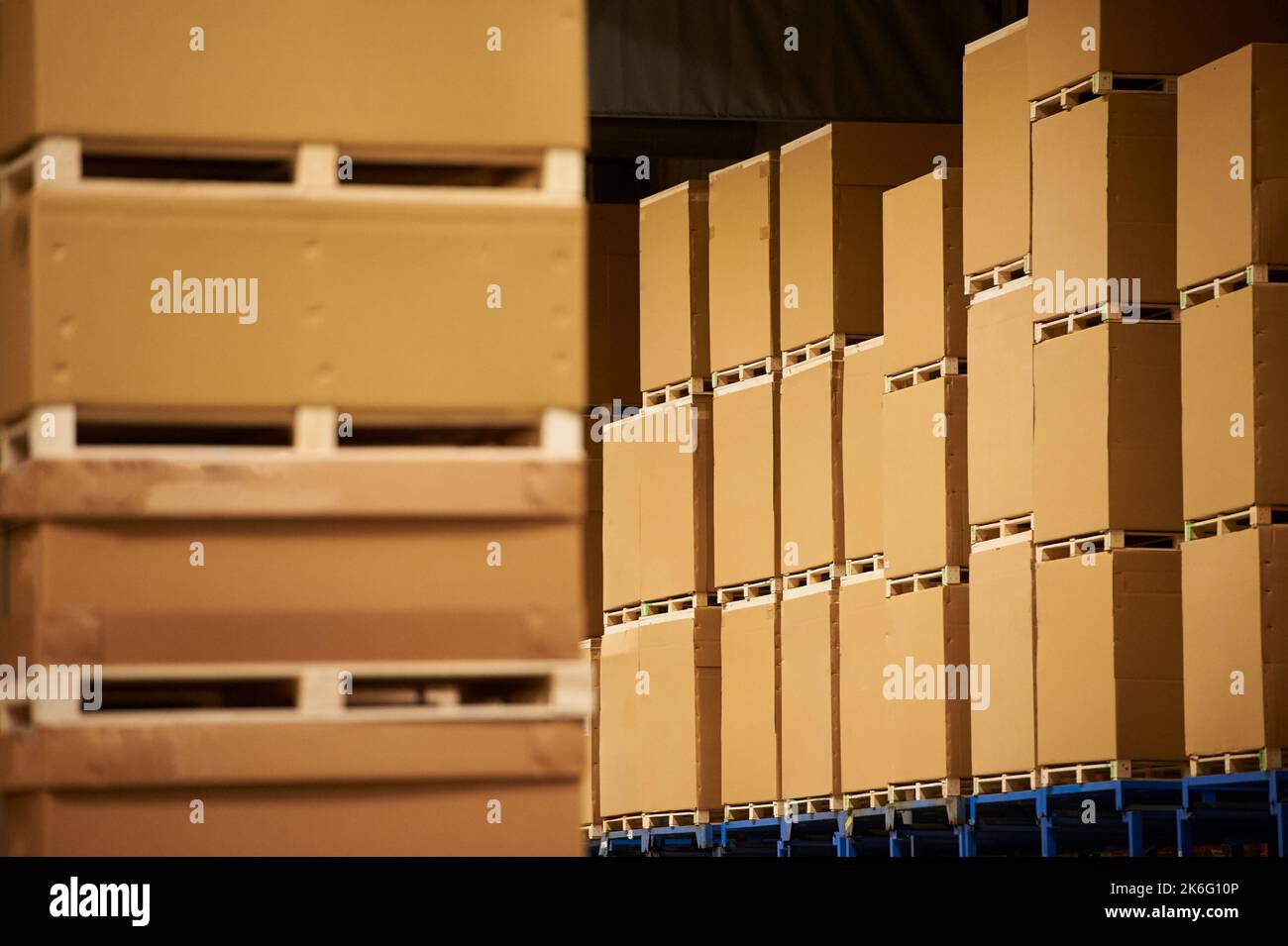 Stack of storage boxes in a warehouse Stock Photo - Alamy