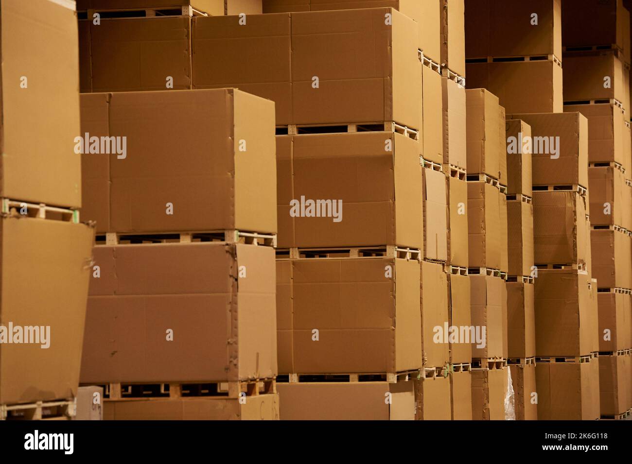 Stack of storage boxes in a warehouse Stock Photo - Alamy