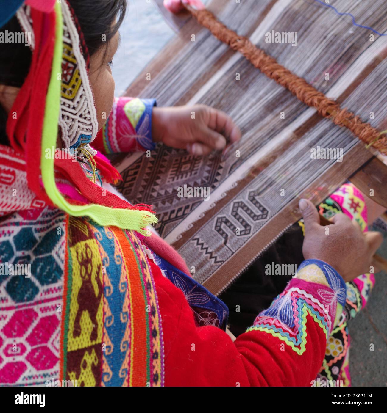 Cusco, Peru - 1 July, 2022: A Quechua lady weaves traditional Andean ...