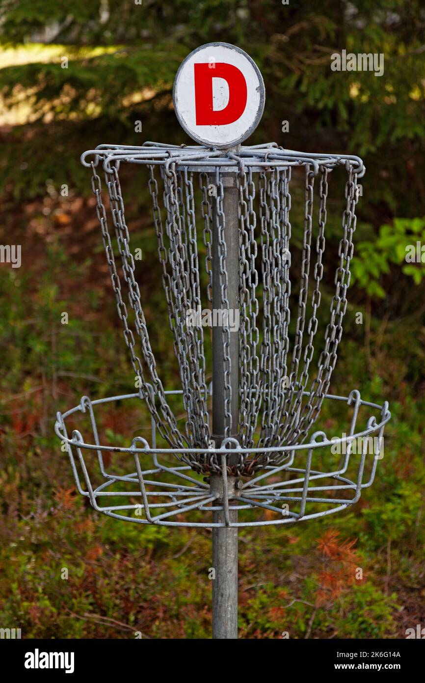 a metal target for frisbee golf in the forest Stock Photo - Alamy