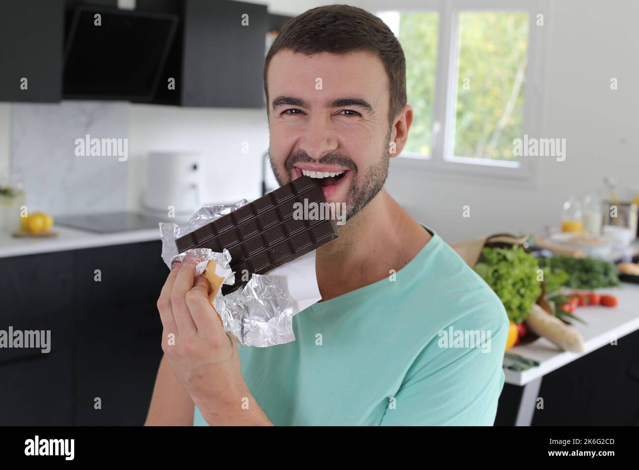 Man chocolate bar hi-res stock photography and images - Alamy