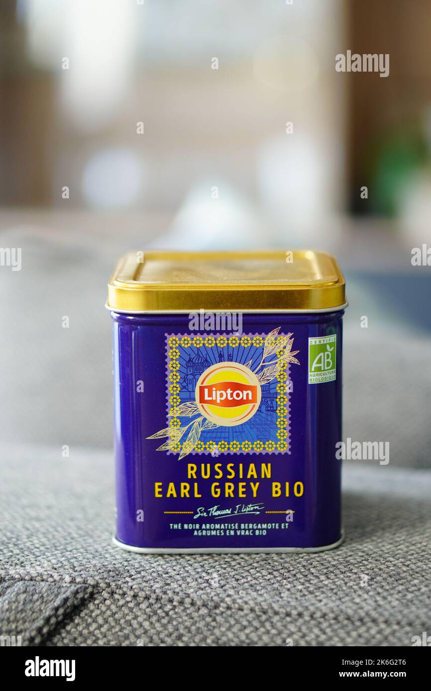 A vertical closeup of a Lipton brand Russian Earl Grey tea in a metal ...