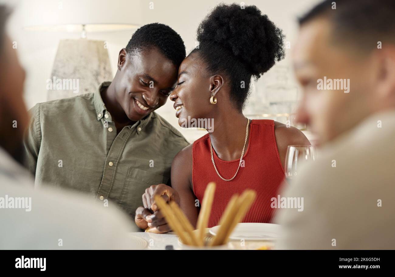 Love makes us feel good. an affectionate couple sitting together inside ...