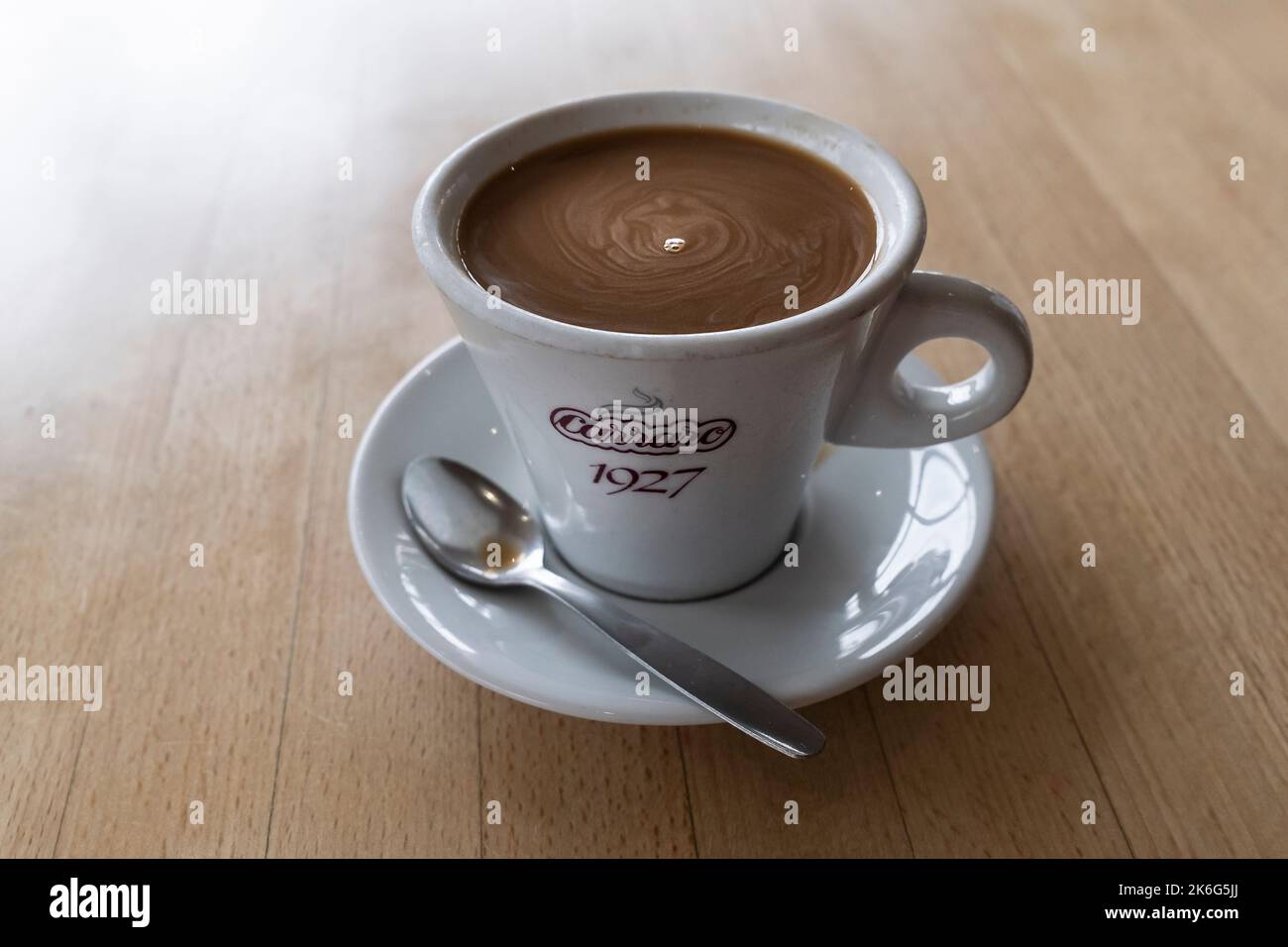 A fresh cup of Carraro coffee on a table in a restaurant cafe coffee ...