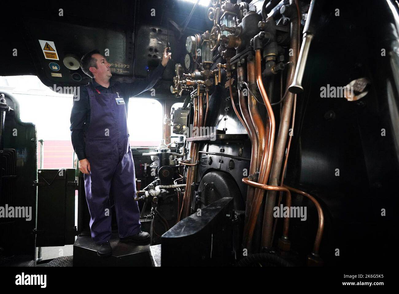 Volunteer train crew member Ian, aboard The Flying Scotsman on Platform 8 at King's Cross ...